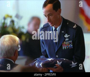 U.S. Air Force Col. Amy Holbeck, center, outgoing commander of the ...
