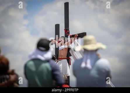 Real crucifixion and flagellants parade for Holy Week, Good Friday ...