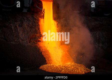 Discharge of metallurgical slag from blast furnaces. Beautiful stream ...