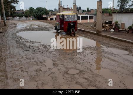Lima, Peru. 14th Mar, 2023. People check on an area affected by ...