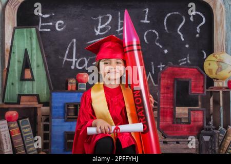 An adorable little boy holding a VPK diploma during kindergarten ...