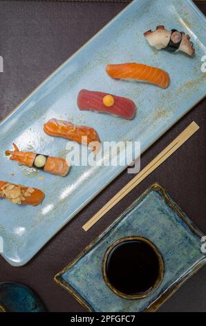 Combined of differents premium japanese sushi ( niguiri) on an elegant ...