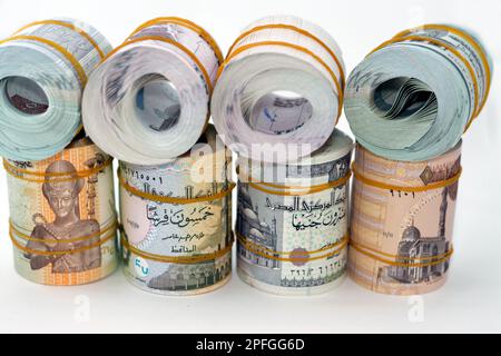 Background of bundles and rolls of Egyptian money currency cash ...