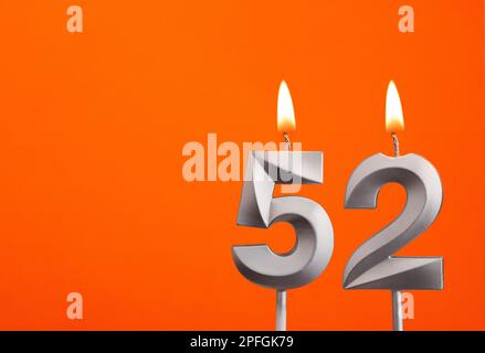 Candle number 52 - Birthday in blues foamy background Stock Photo - Alamy