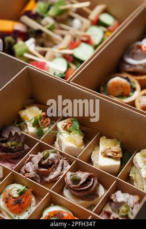 Exotic appetizers delivered in a box for venue. Delicious little snacks ...