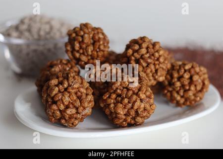 Puffed finger millet sweet ball or Ragi kurmura ladu. Sweet balls made ...