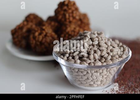 Puffed and roasted finger millet in a bowl. Finger millet is also known ...