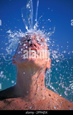 Clean water being sprayed in opposite directions into a basin from ...