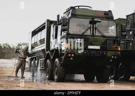A NBC defense soldier in protective gear, pictured decontaminating ...