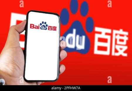 A hand holding a phone with the Baidu website on the screen Stock Photo ...