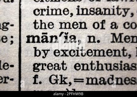 Definition of word maniac on dictionary page, close-up Stock Photo - Alamy
