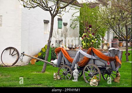 cart with flowers and figures of Easter rabbits on farm Stock Photo - Alamy