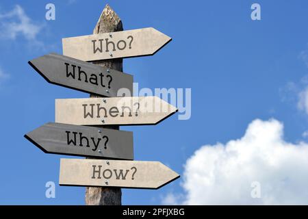 Who, what, when, why, how - signpost with five arrows Stock Photo - Alamy
