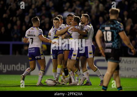 Warrington Wolves Paul Vaughan is mobbed after he scores during the ...