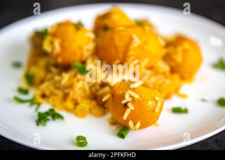 Traditional Brazilian delicacy, rice with chicken and pequi (Caryocar ...