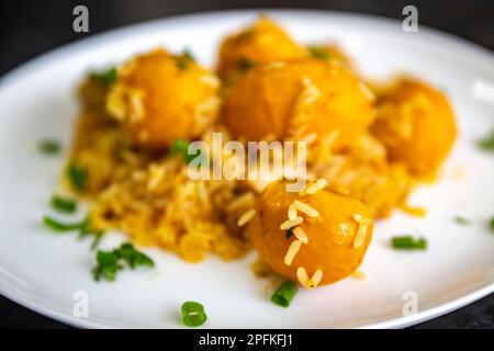 Traditional Brazilian delicacy, rice with chicken and pequi (Caryocar ...