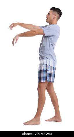 Somnambulist in pajamas on white background. Sleepwalking Stock Photo ...