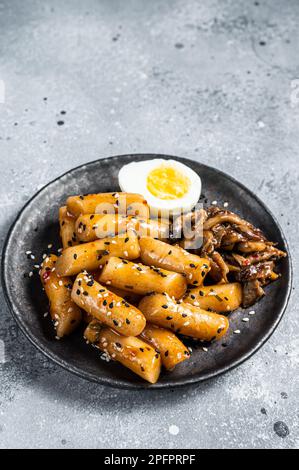 Tteokbokki or Topokki, fried rice cake stick, popular Korean street ...