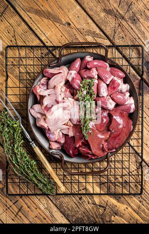 Raw bird giblets meat set, chicken offals, liver, hearts, gizzards ...