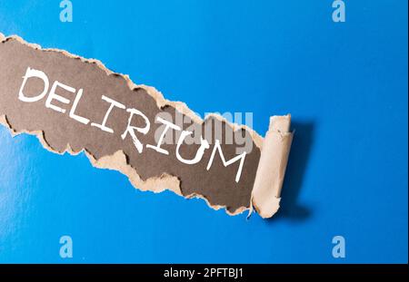 Delirium word written under torn paper Stock Photo - Alamy