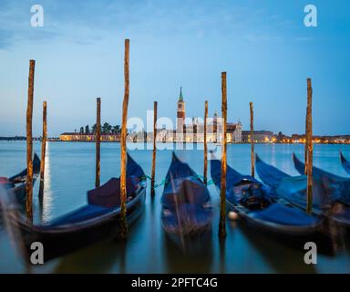 Moving Gondolas on Venice waterfront, San Giorgio Maggiore on the ...