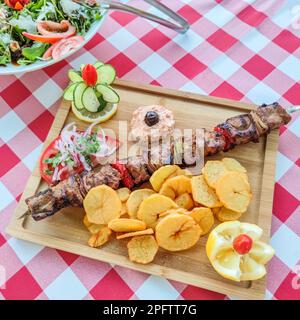 Greek kontosouvli large souvlaki made by fresh meat grilled on fire and ...