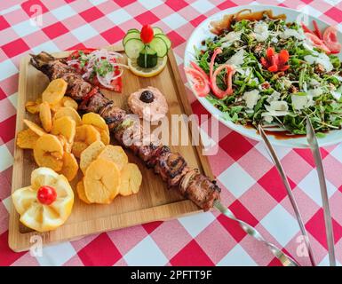 Greek kontosouvli large souvlaki made by fresh meat grilled on fire and ...