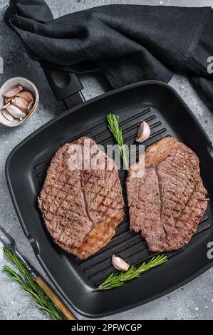 Roasted on a grill skillet Flank flap or Bavette beef meat steak with ...