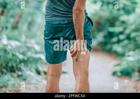 Fitness, hamstring and injury with a sports man holding his muscle in ...