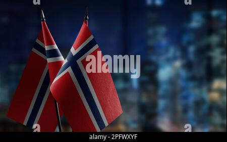 Small flags of the Norway on an abstract blurry background Stock Photo ...