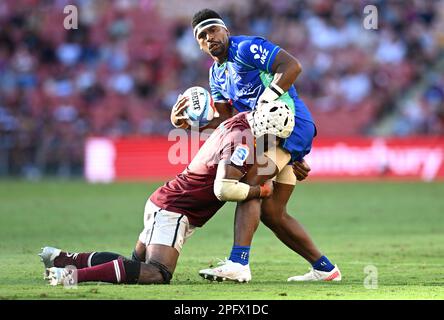 Kalaveti Ravouvou of the Fijian Drua is tackled by Seru Uru of the Reds ...