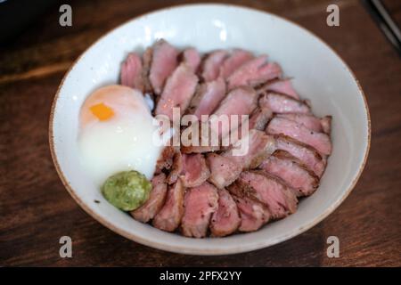 Steak Don, a Japanese dish consisting of a bowl of rice topped with ...