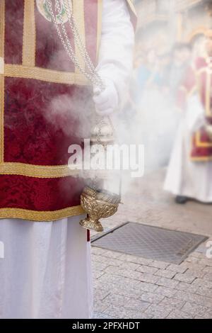 Censer being shaking by a altar boy or acolyte in the holy week ...