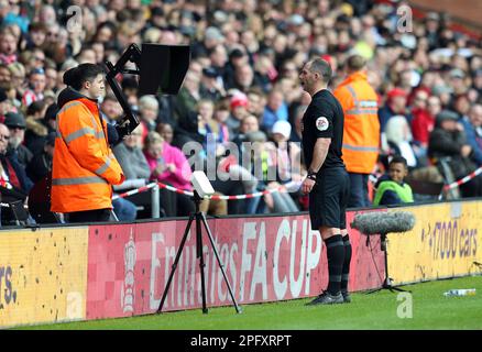 Referee Tim Robinson checks VAR for a penalty during the Premier League ...