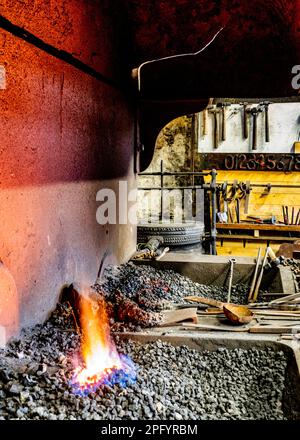 Cracked wraught iron forge hood at Combe Mill Stock Photo - Alamy
