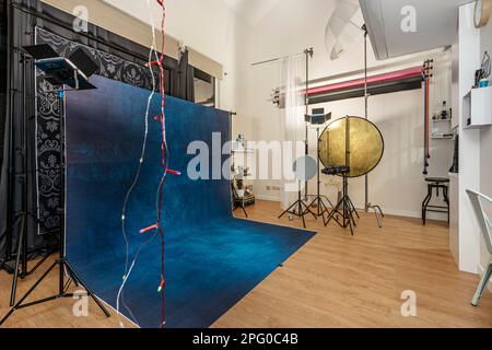 Photography studio with diffusers, backgrounds, spotlights and other ...