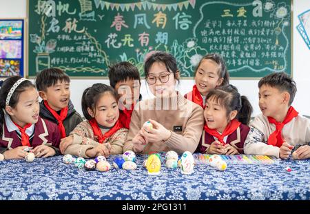 Primary school students paint eggs for Dragon Boat Festival in Lianyun ...