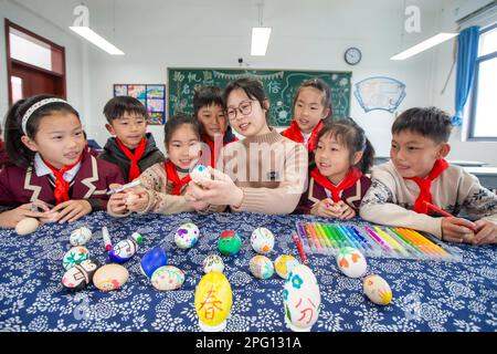 Primary school students paint eggs for Dragon Boat Festival in Lianyun ...