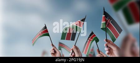 Hands Holding Flag of the Nation Kenya Stock Photo - Alamy