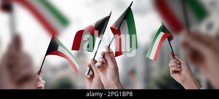Hands Holding Flag of the Nation Kuwait Stock Photo - Alamy