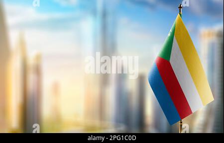 Small flags of the Comoros on an abstract blurry background Stock Photo ...