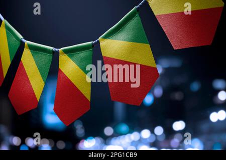 A garland of Congo national flags on an abstract blurred background ...