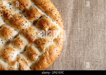 Traditional Ramadan pita on burlap sack.Holy bread for Muslims Stock ...