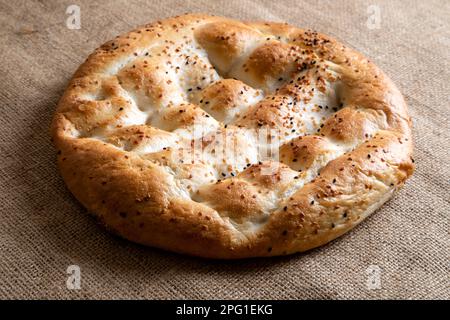 Top view of a Ramadan pita bread on a jute background Stock Photo - Alamy