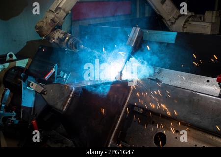 Industrial welding robot. Robot coded to weld is working. Digital ...