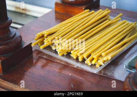 Church candles. Candle stand in the church. Lighting the Fire and ...