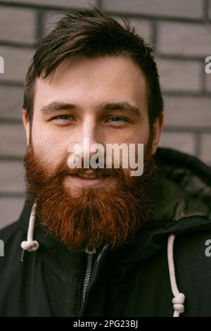 young handsome hipster ginger bearded guy looking brutal isolated on ...