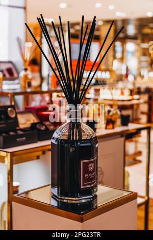 Bamboo sticks in a black bottle with indoor perfumes. Glass diffuser ...