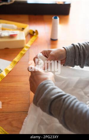 garment sewn by hand using sewing tools Stock Photo - Alamy