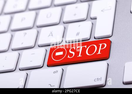 Aluminium keyboard with STOP word in red. Studio photo. Standard ...